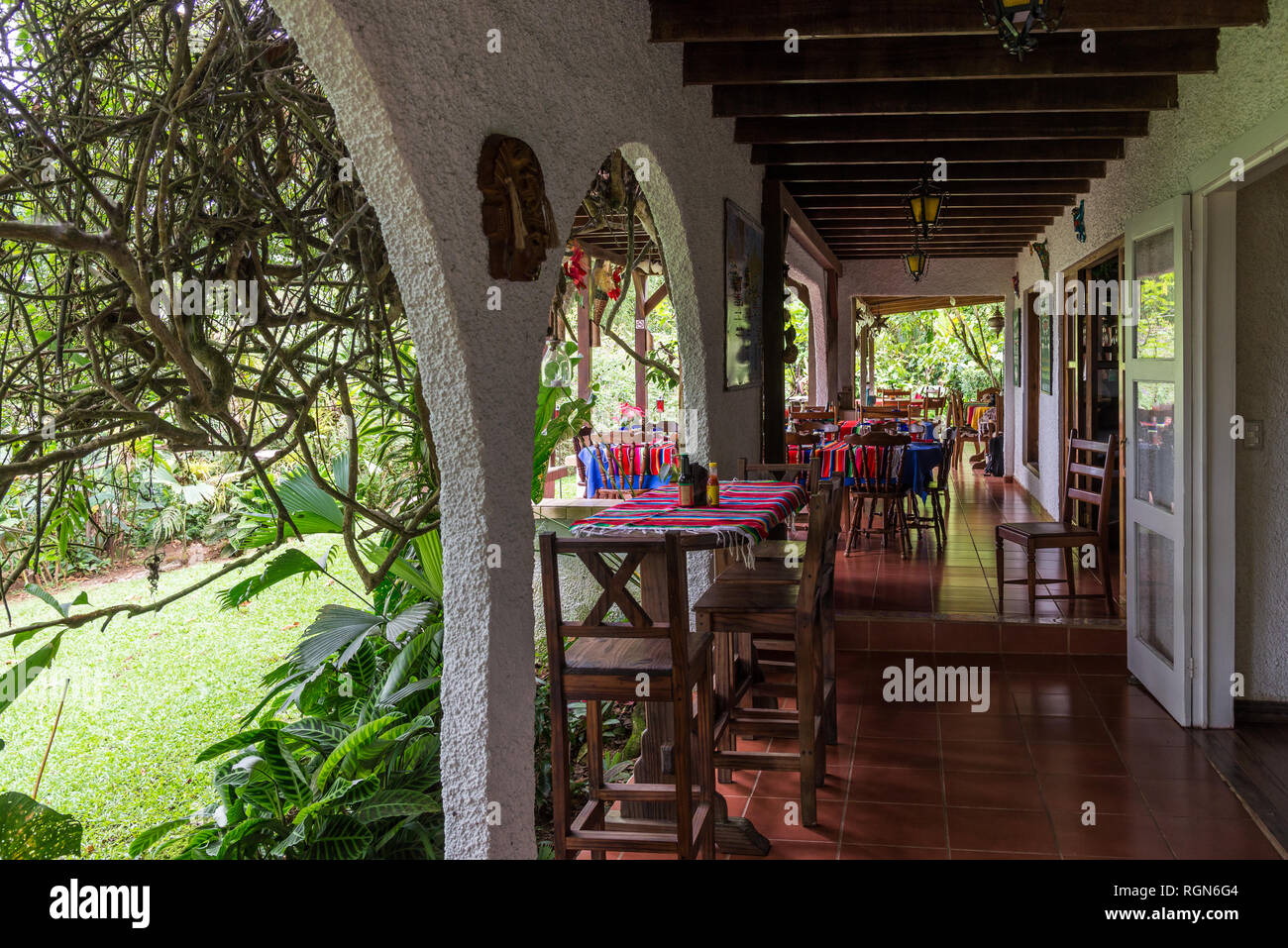 Dinning tables with colorful table cloth at an eco-lodge. Costa Rica ...