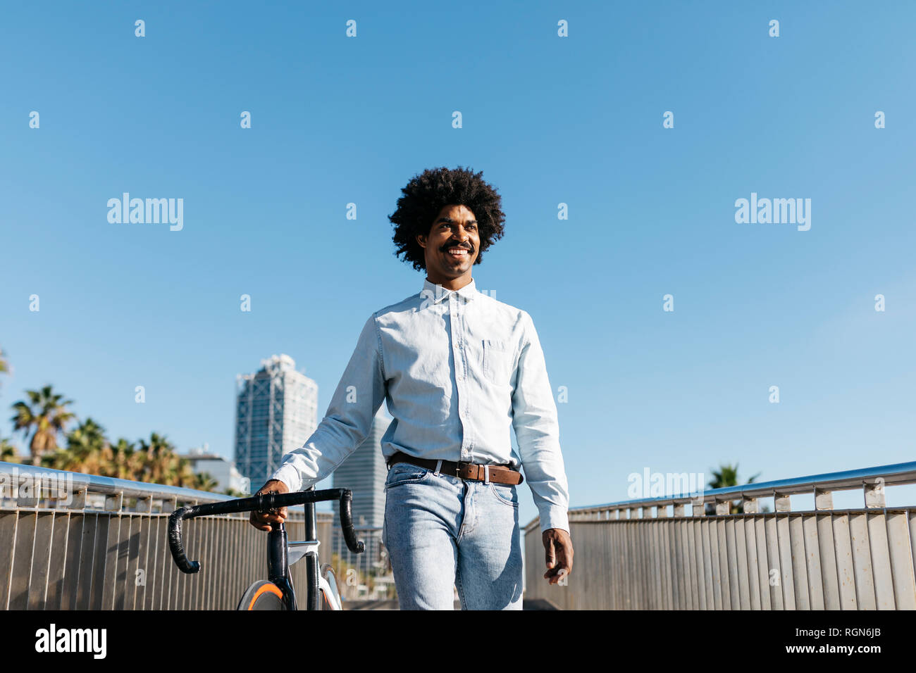 Man pushing his bicycle hi-res stock photography and images - Alamy
