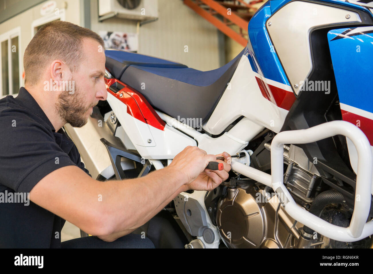 Two men repair motorcycle hi-res stock photography and images - Alamy