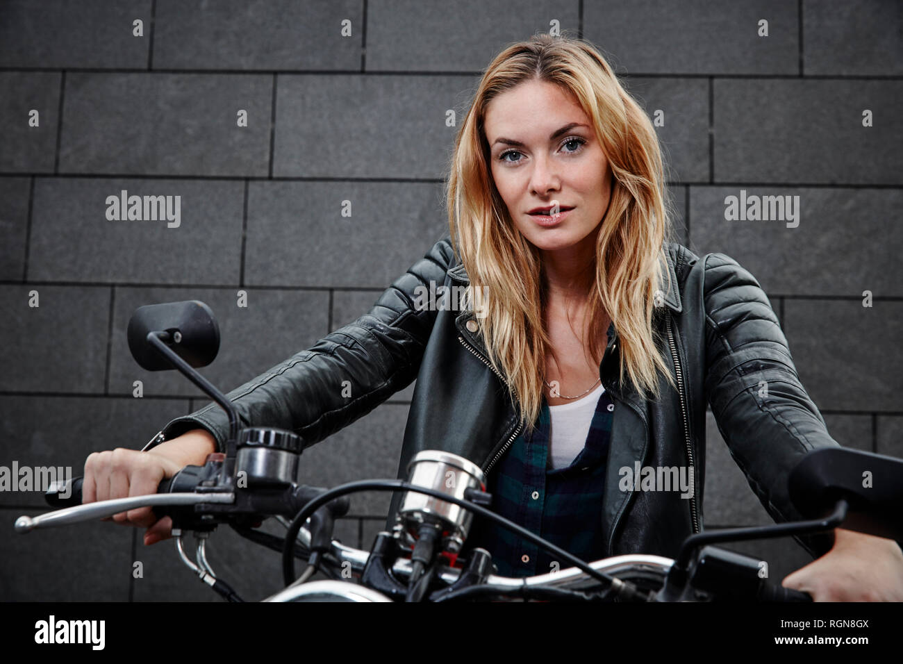 Woman poised wall hi-res stock photography and images - Alamy