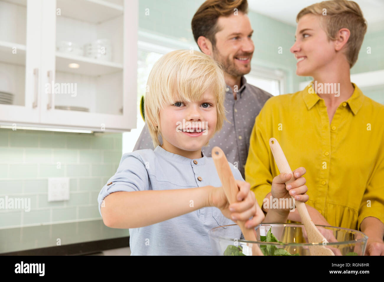 Family smiling together in kitchen hi-res stock photography and images ...