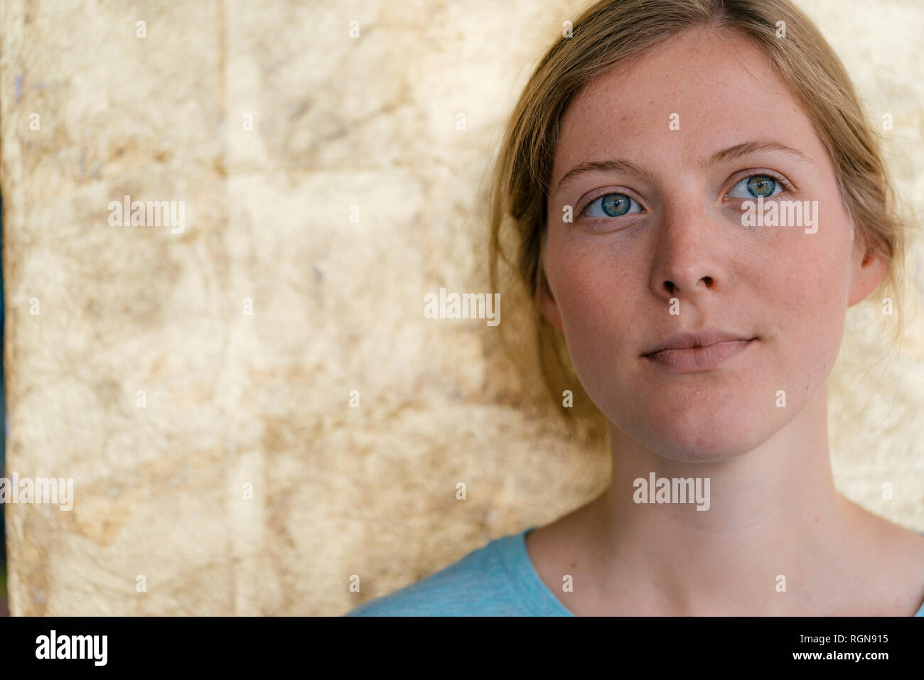 Portrait of young woman thinking Stock Photo - Alamy