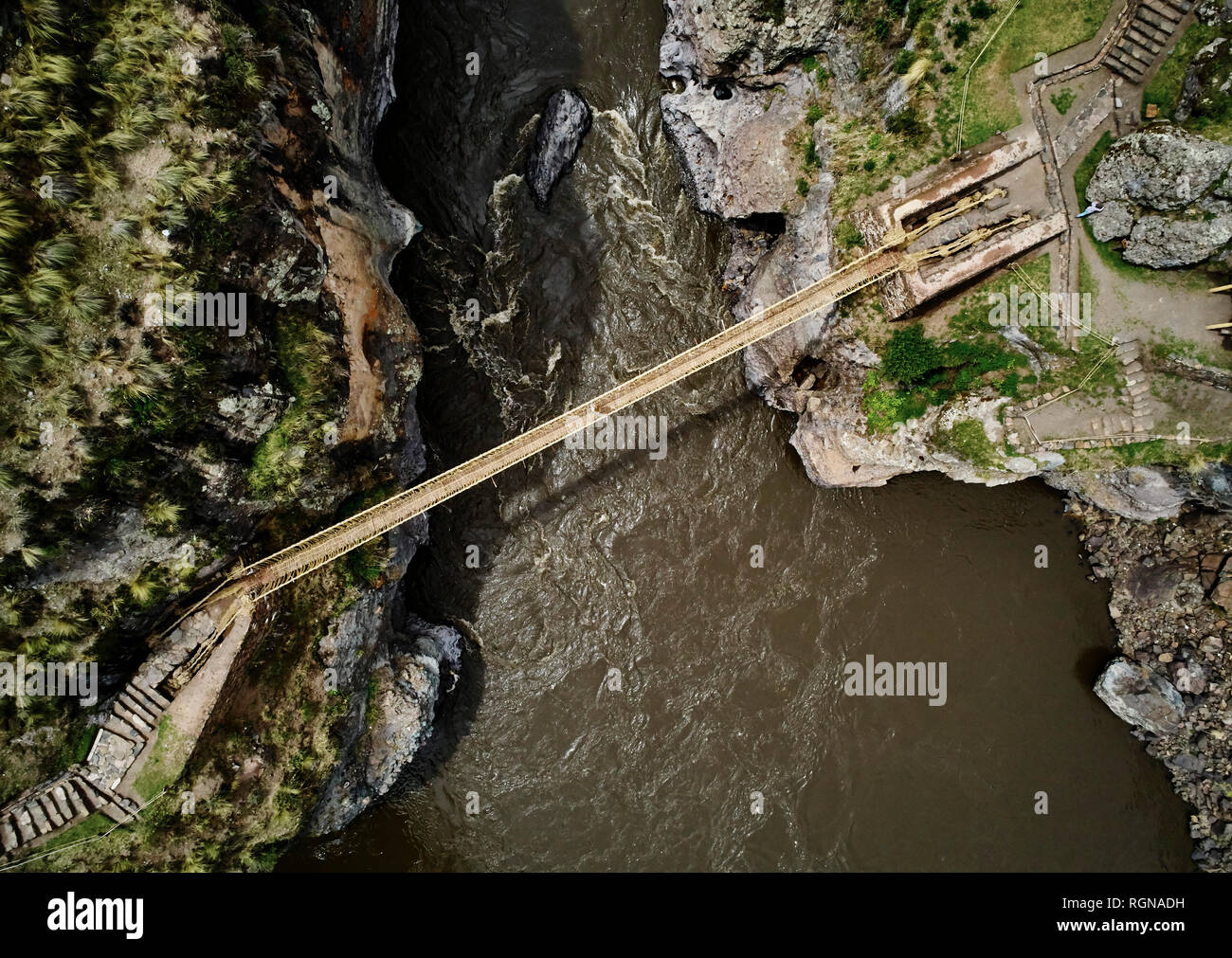 Aerial woman crossing rope bridge hi-res stock photography and images ...