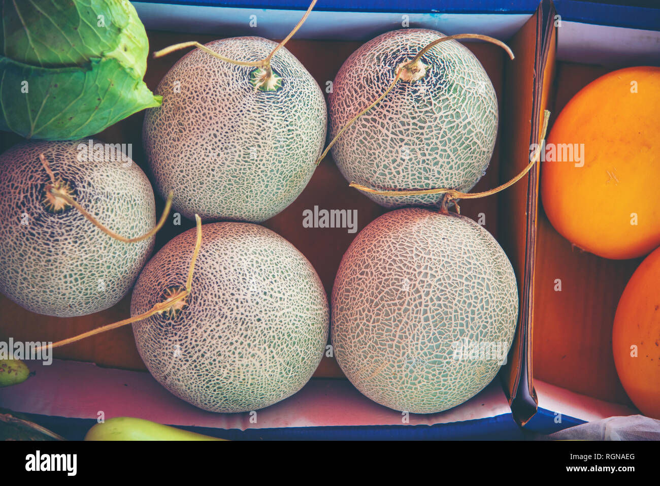 Melon placed on the fruit panel at the market Stock Photo - Alamy