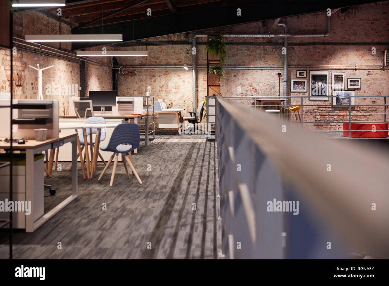 Interior of a modern industrial style loft office Stock Photo - Alamy