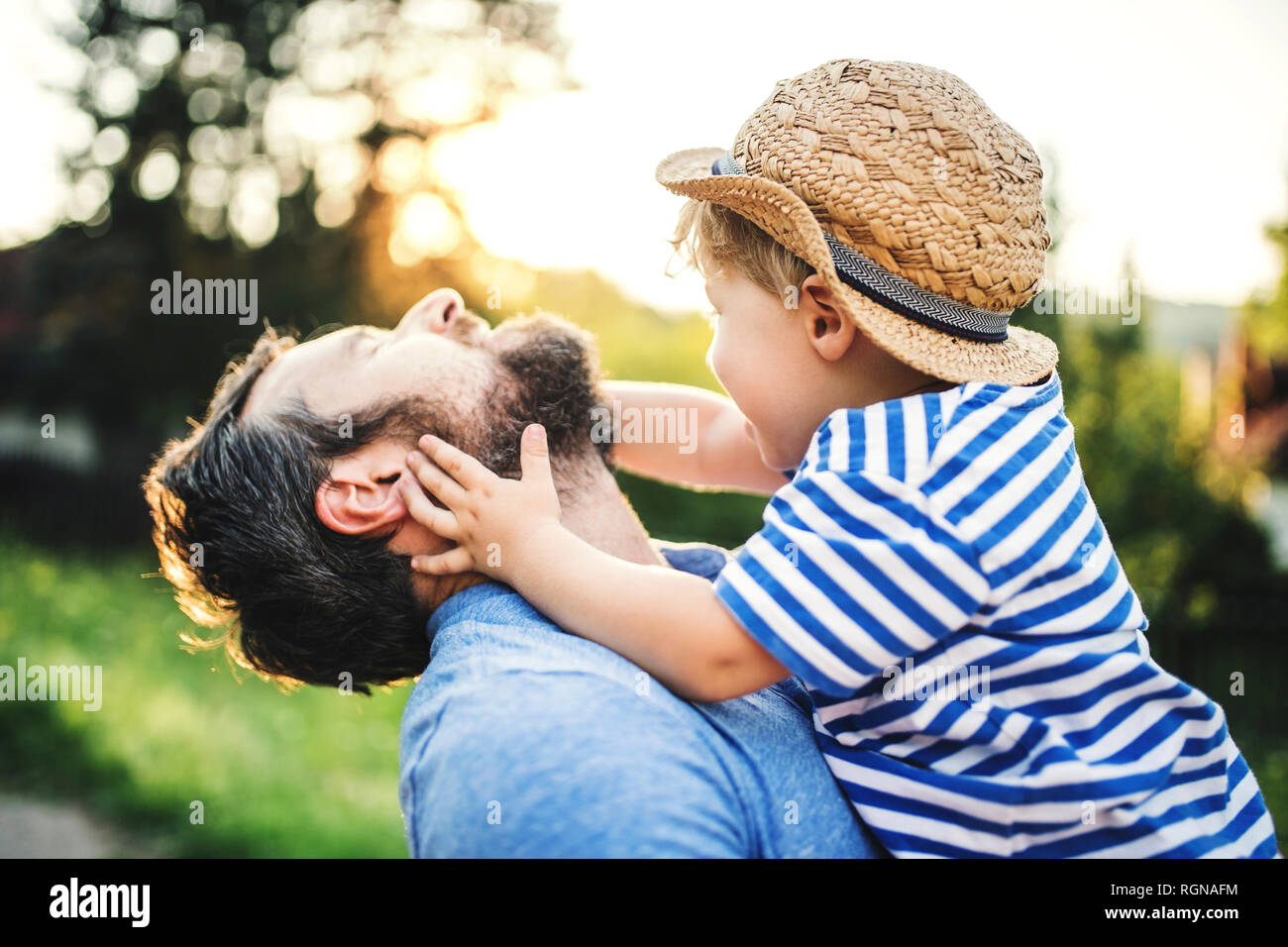 Little boy having fun with his father outdoors Stock Photo - Alamy