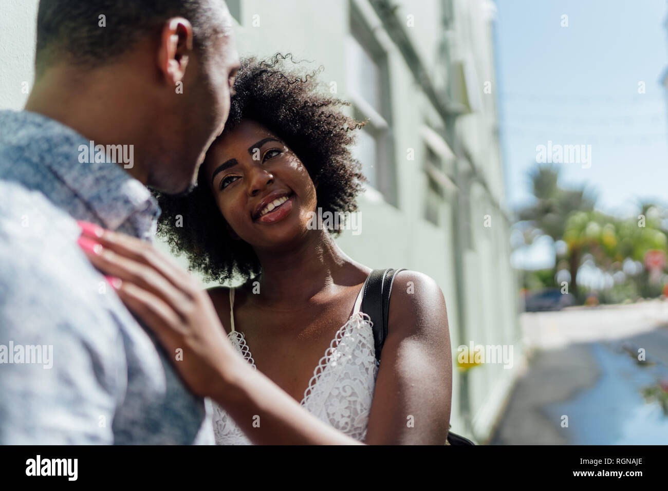 Affectionate young couple facing each other Stock Photo - Alamy
