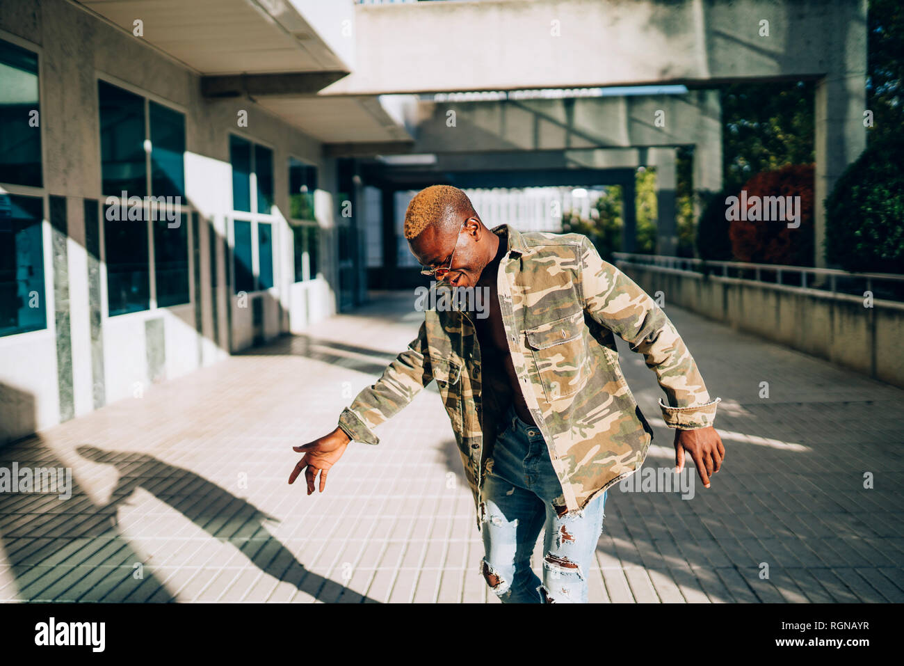 Young black male dancing hi-res stock photography and images - Alamy