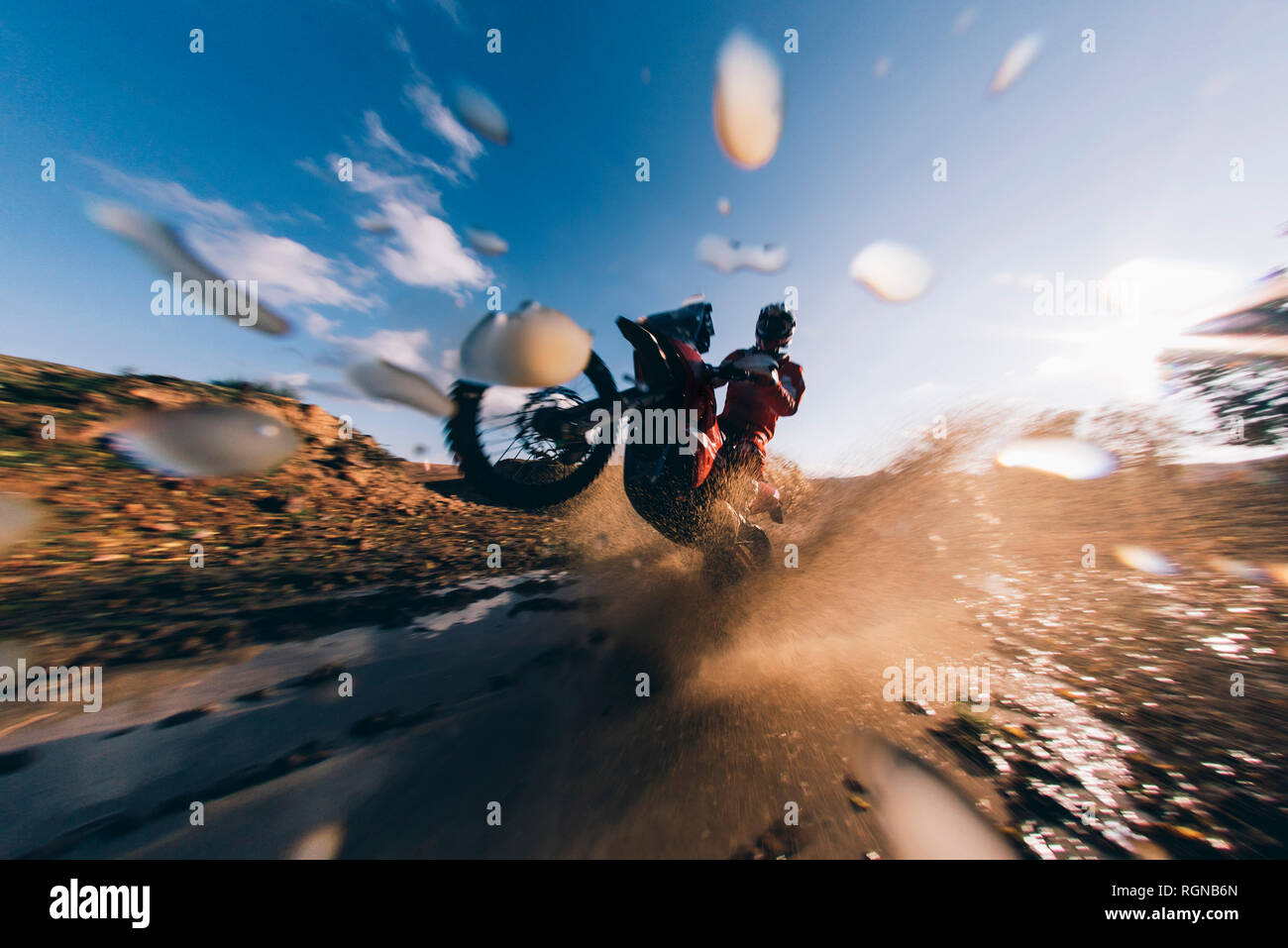Motocross driver driving through water hi-res stock photography and ...