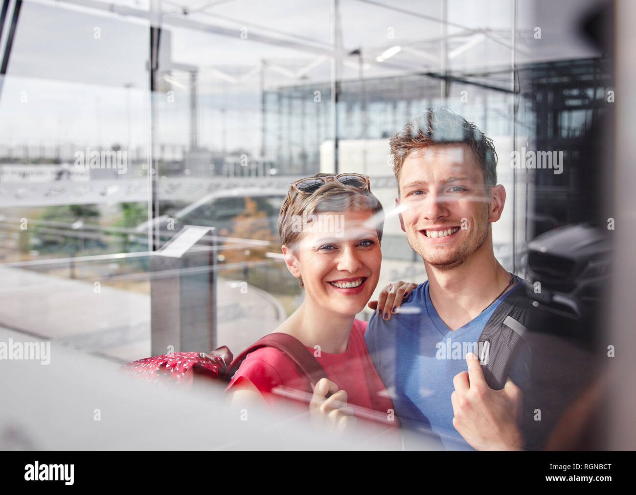 Portrait of smiling couple at the airport Stock Photo - Alamy