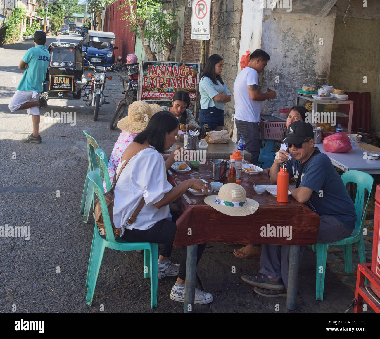 Eating empanadas, a specialty of Vigan, Ilocos Sur, Philippines Stock ...