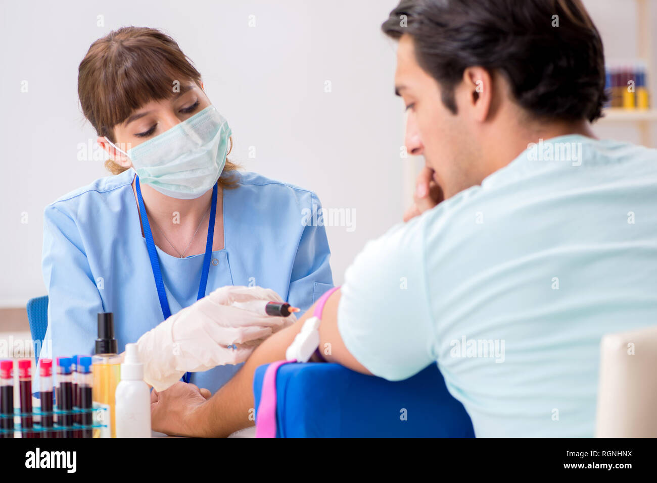 Young patient during blood test sampling procedure Stock Photo - Alamy