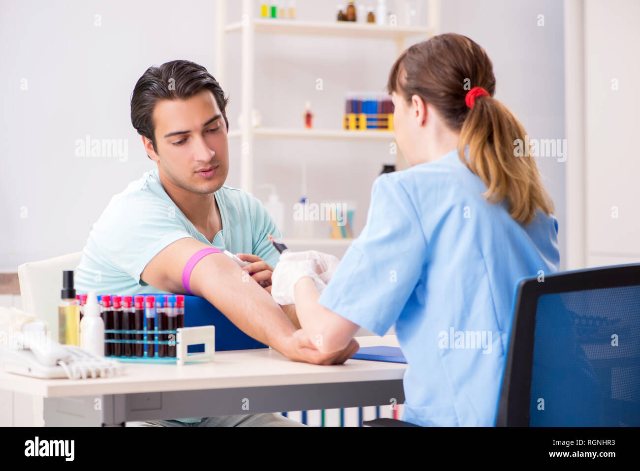 Young patient during blood test sampling procedure Stock Photo - Alamy