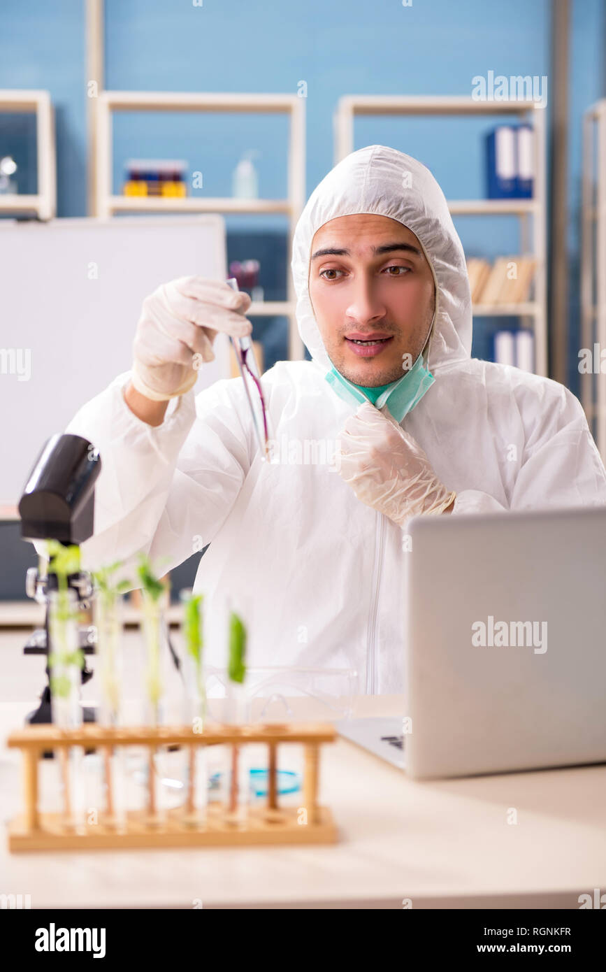 Male biotechnology scientist chemist working in the lab Stock Photo - Alamy