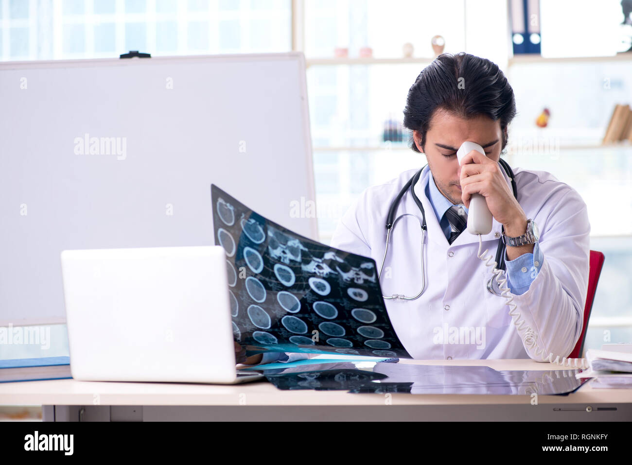 Young handsome male radiologist in front of whiteboard Stock Photo - Alamy