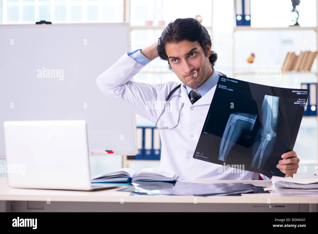 Young handsome male radiologist in front of whiteboard Stock Photo - Alamy