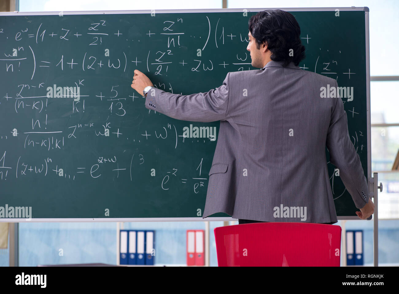 Back view young maths teacher hi-res stock photography and images - Alamy
