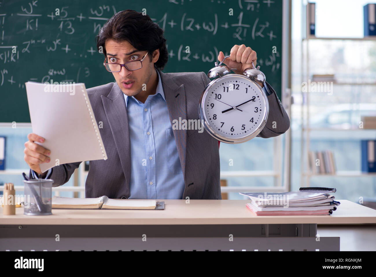 Professor and student discussing paper hi-res stock photography and ...