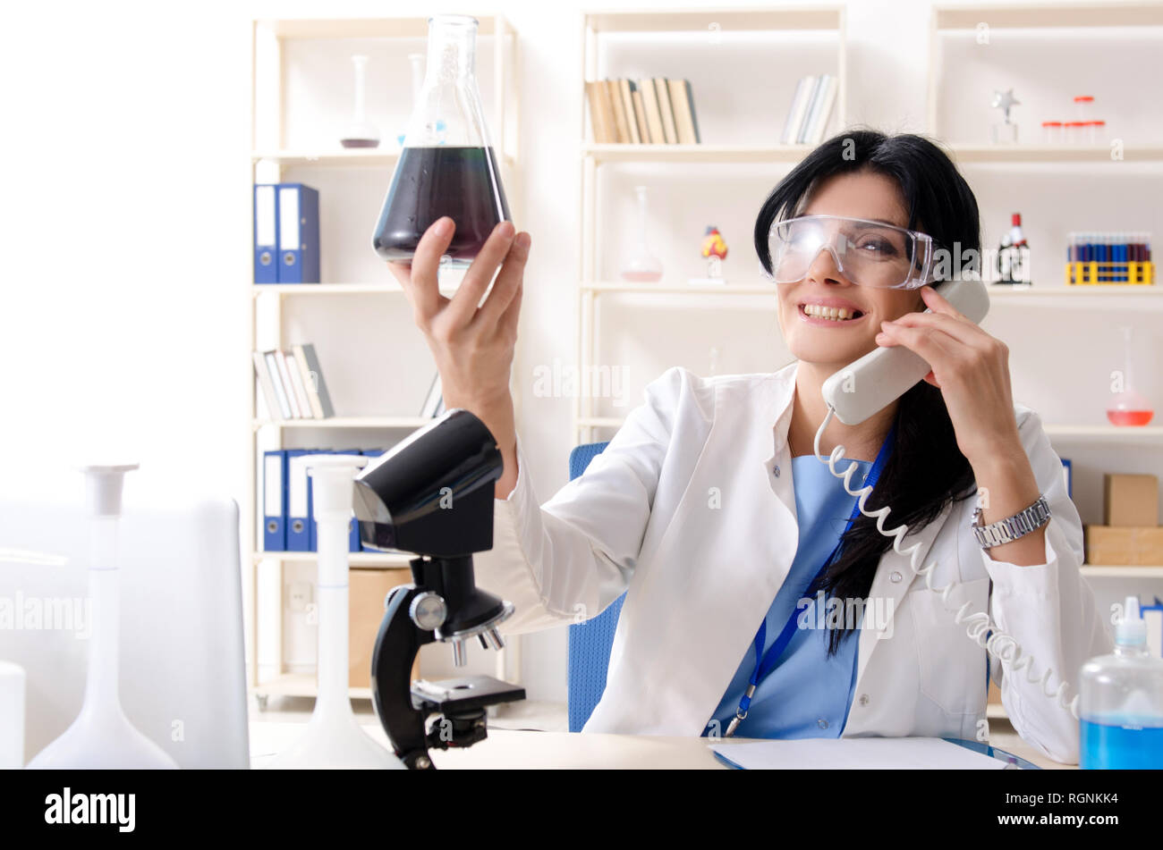 Female chemist working at the lab Stock Photo - Alamy