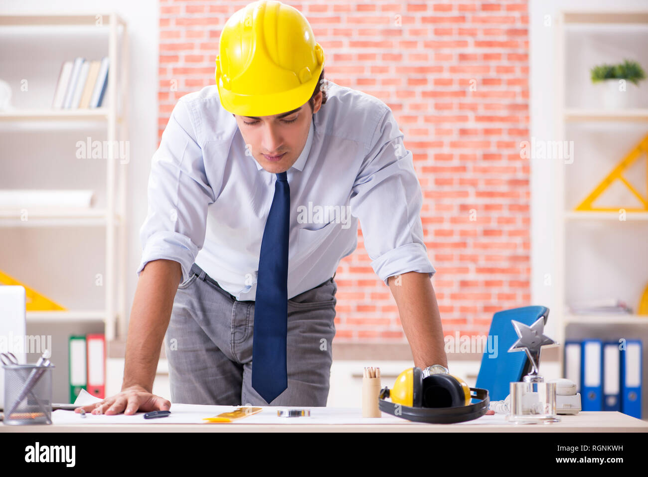 Construction supervisor working on blueprints Stock Photo - Alamy