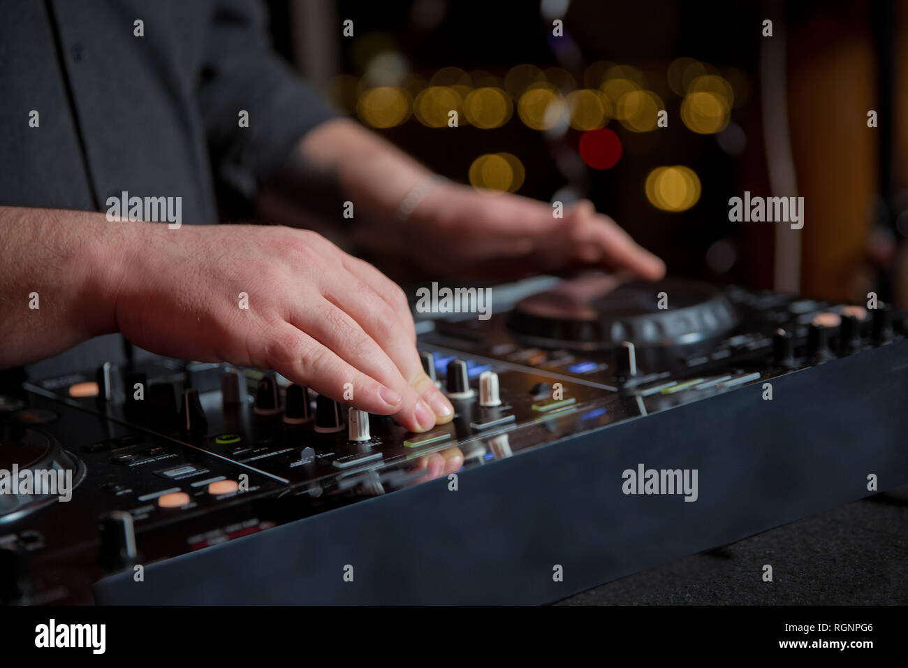 Professional disc jockey mix popular musical tracks with vintage ...