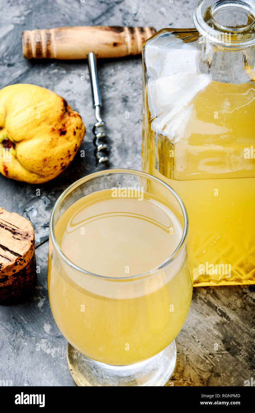 Aromatic wine from the fruit of the autumn quince Stock Photo - Alamy