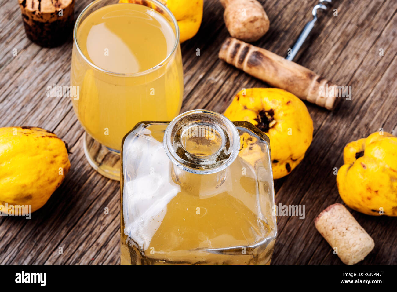 Quince tincture.Wine from the fruit of the autumn quince Stock Photo ...