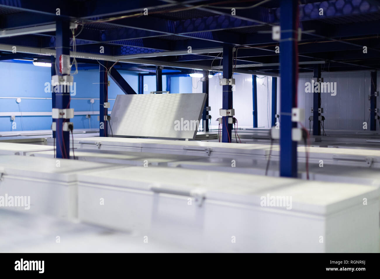 Warehouse with white refrigerators Stock Photo - Alamy