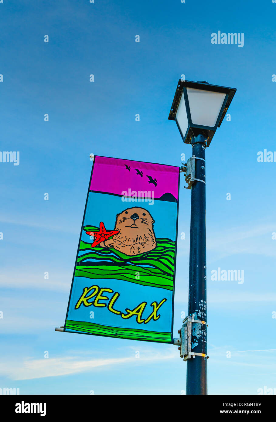 Relax sign on the beach with blue sky for background Stock Photo - Alamy