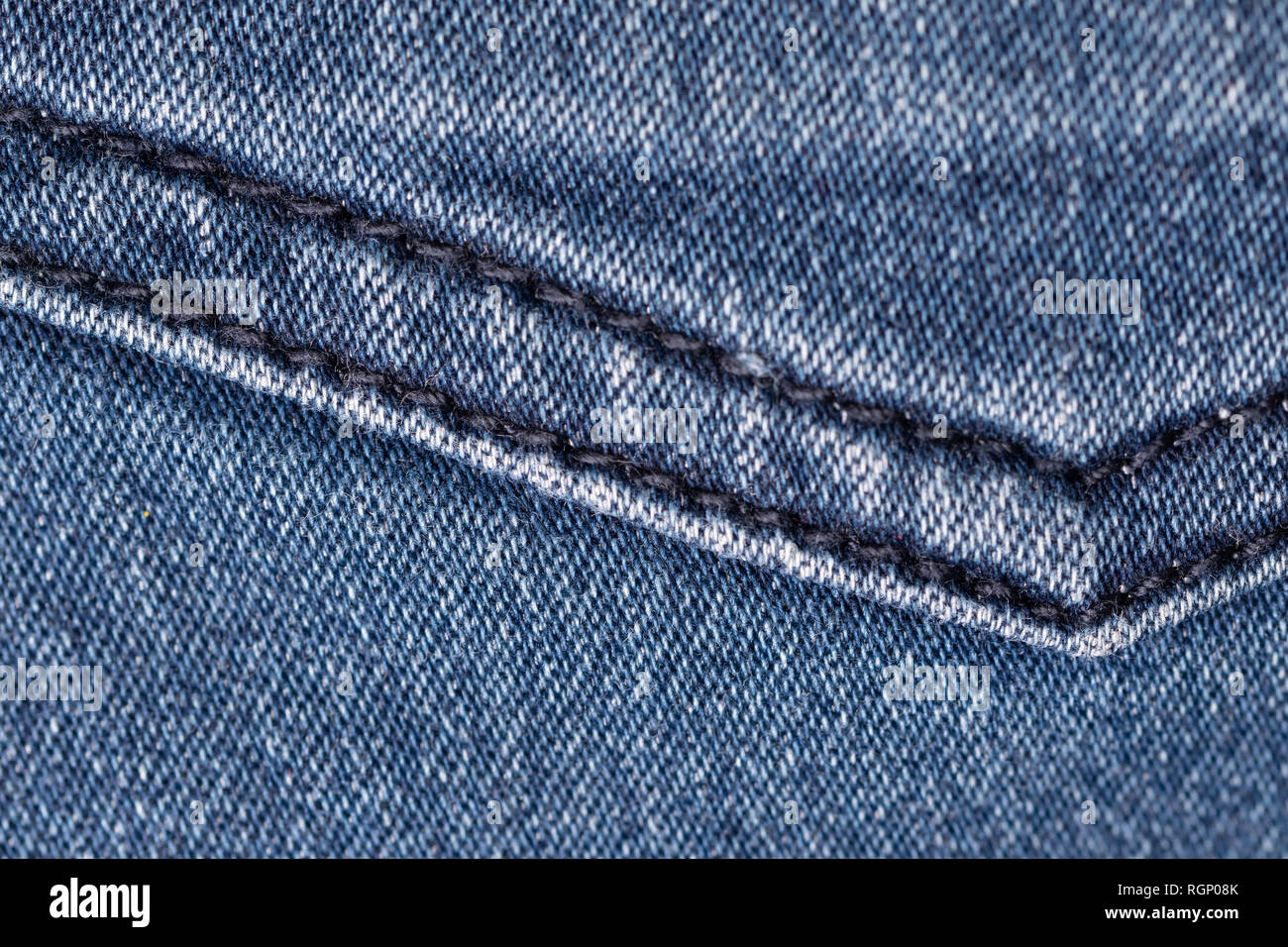 Blue jeans material pattern. Seam on a material Stock Photo - Alamy