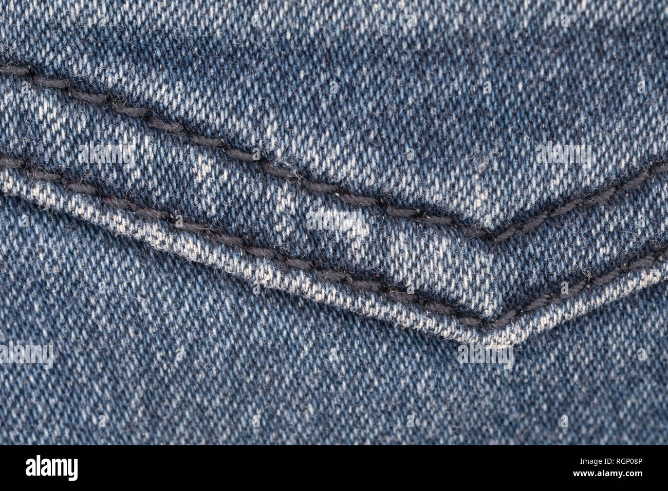 Blue jeans material pattern. Seam on a material Stock Photo - Alamy