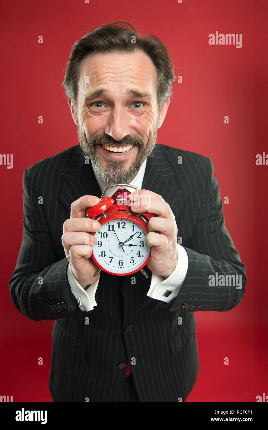 Time is merciless. Businessman formal suit hold alarm clock. Deadline ...