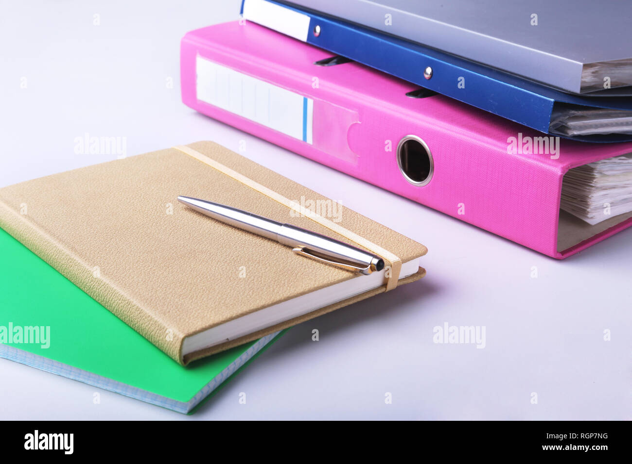 Folder file, note and pen on the desk. blurred background Stock Photo ...