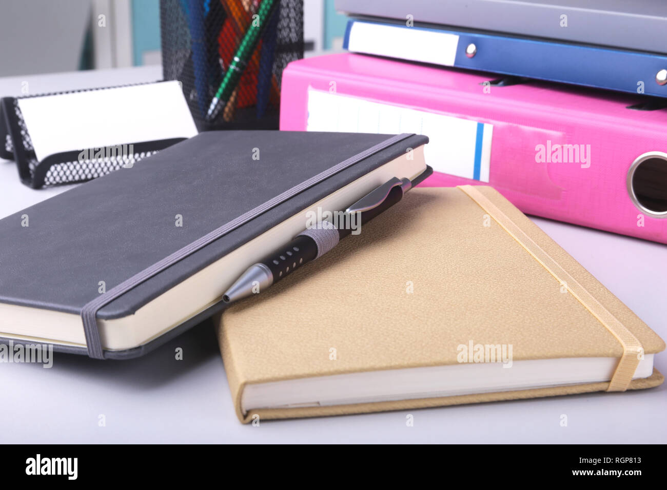 Folder file, note and pen on the desk. blurred background Stock Photo ...