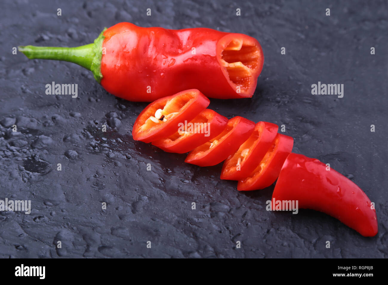 CloseUp top view red chili pepper with sliced, raw food ingredient ...