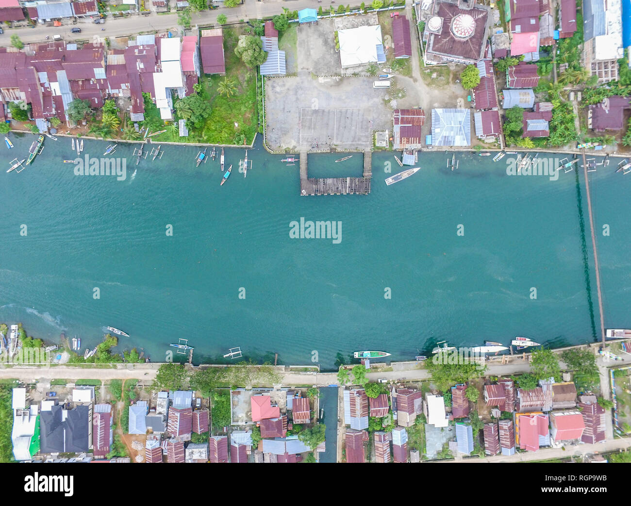 Traditional boat docking in the landscape of Malili River. Malili is ...