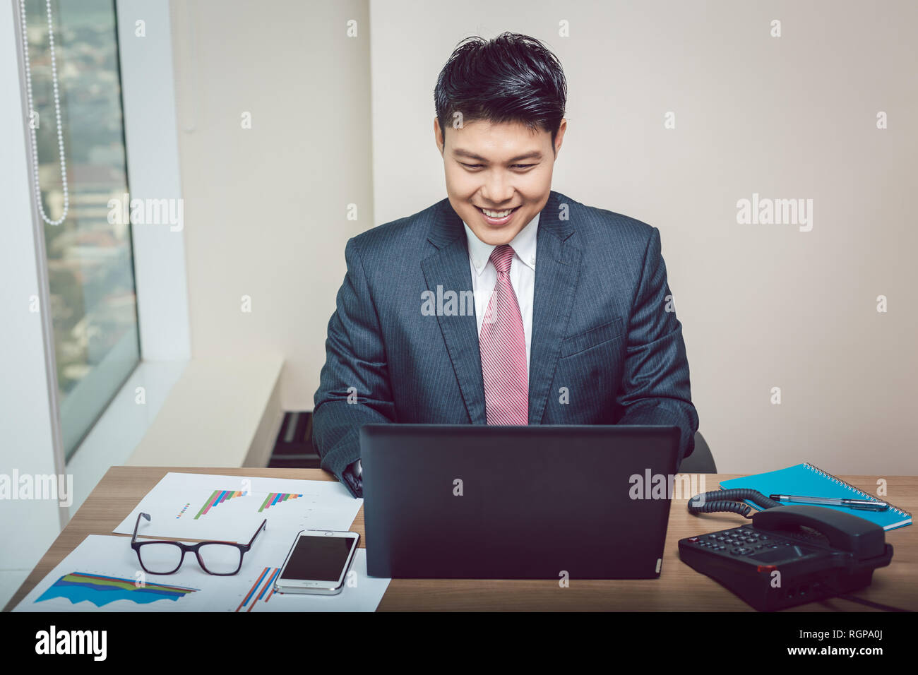 Happy chinese businessman using hi-res stock photography and images - Alamy