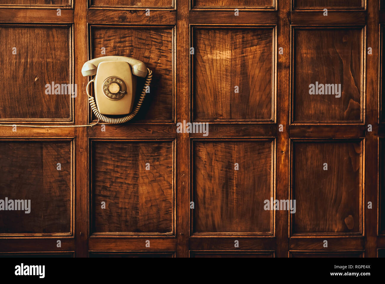 Vintage telephone hanging on the wall hi-res stock photography and ...