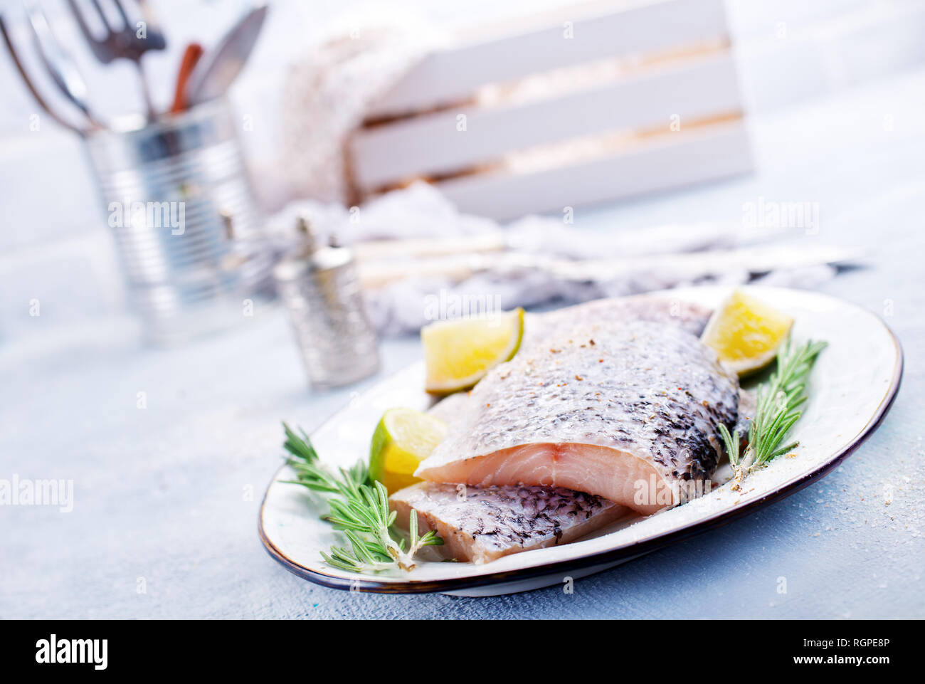 Fresh fish, raw cod fillets with rosemary and salt Stock Photo - Alamy