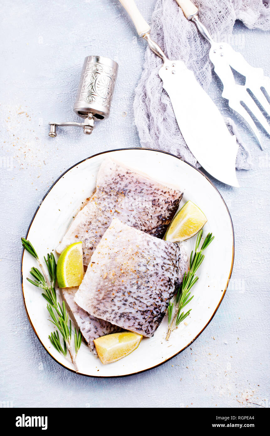 Fresh fish, raw cod fillets with rosemary and salt Stock Photo - Alamy