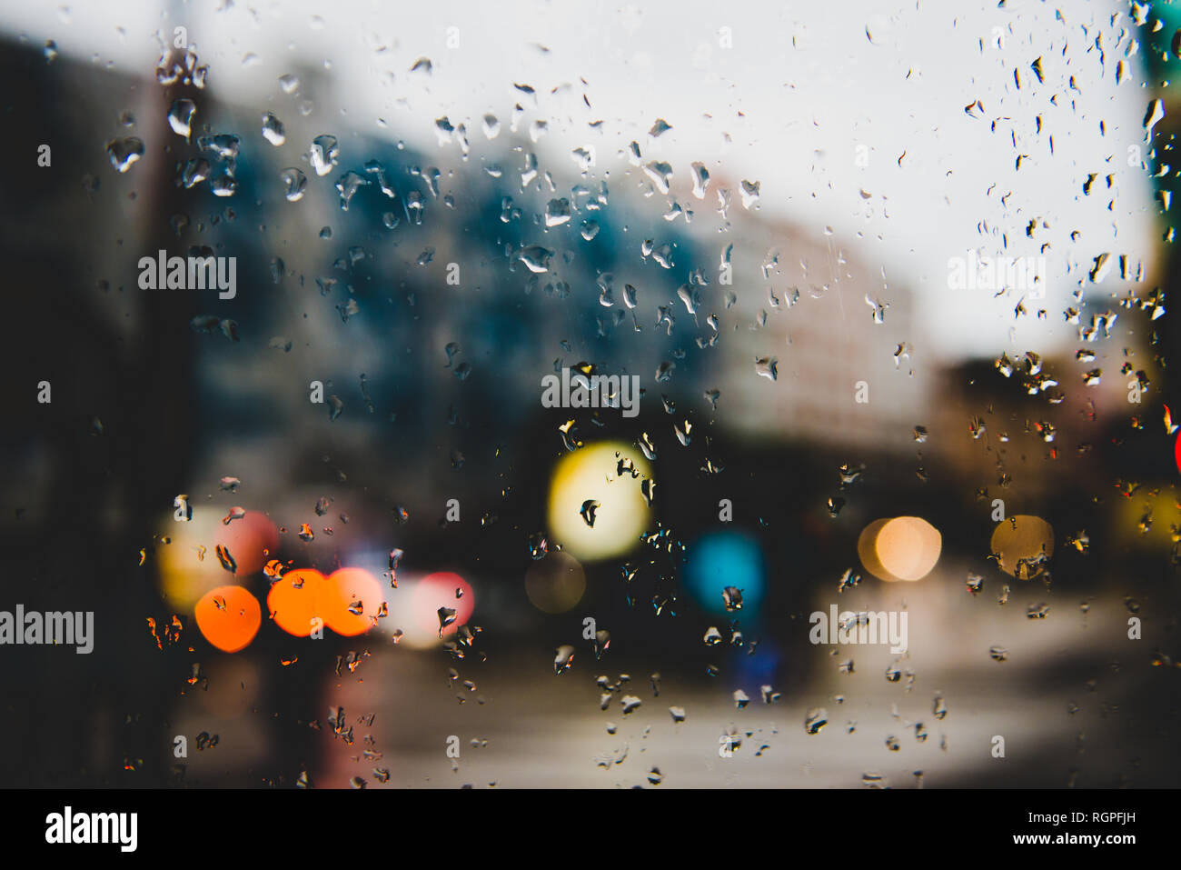 Abstract view of window with spots and city street on blurred ...