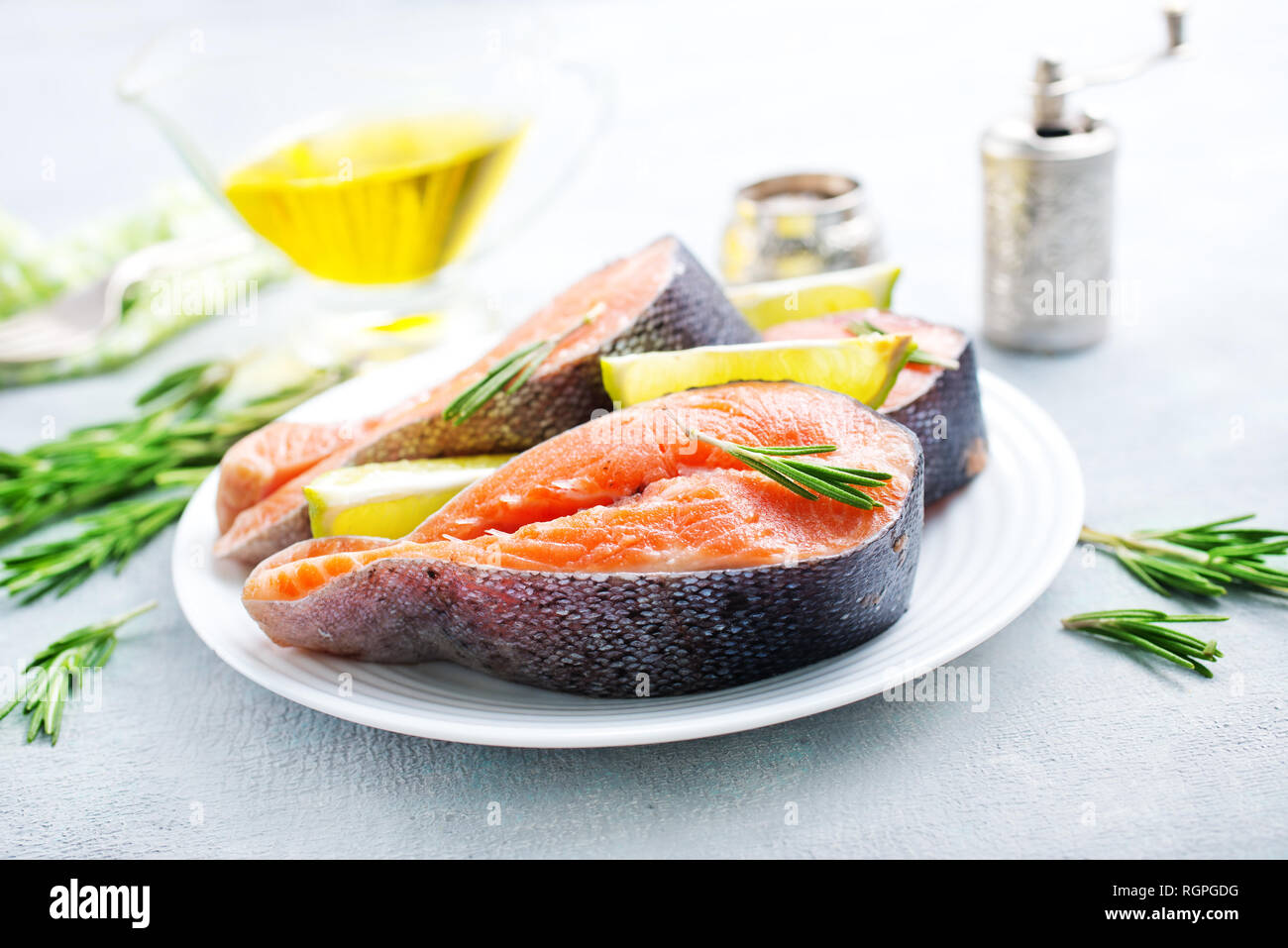 raw salmon steak with spice and oil Stock Photo - Alamy