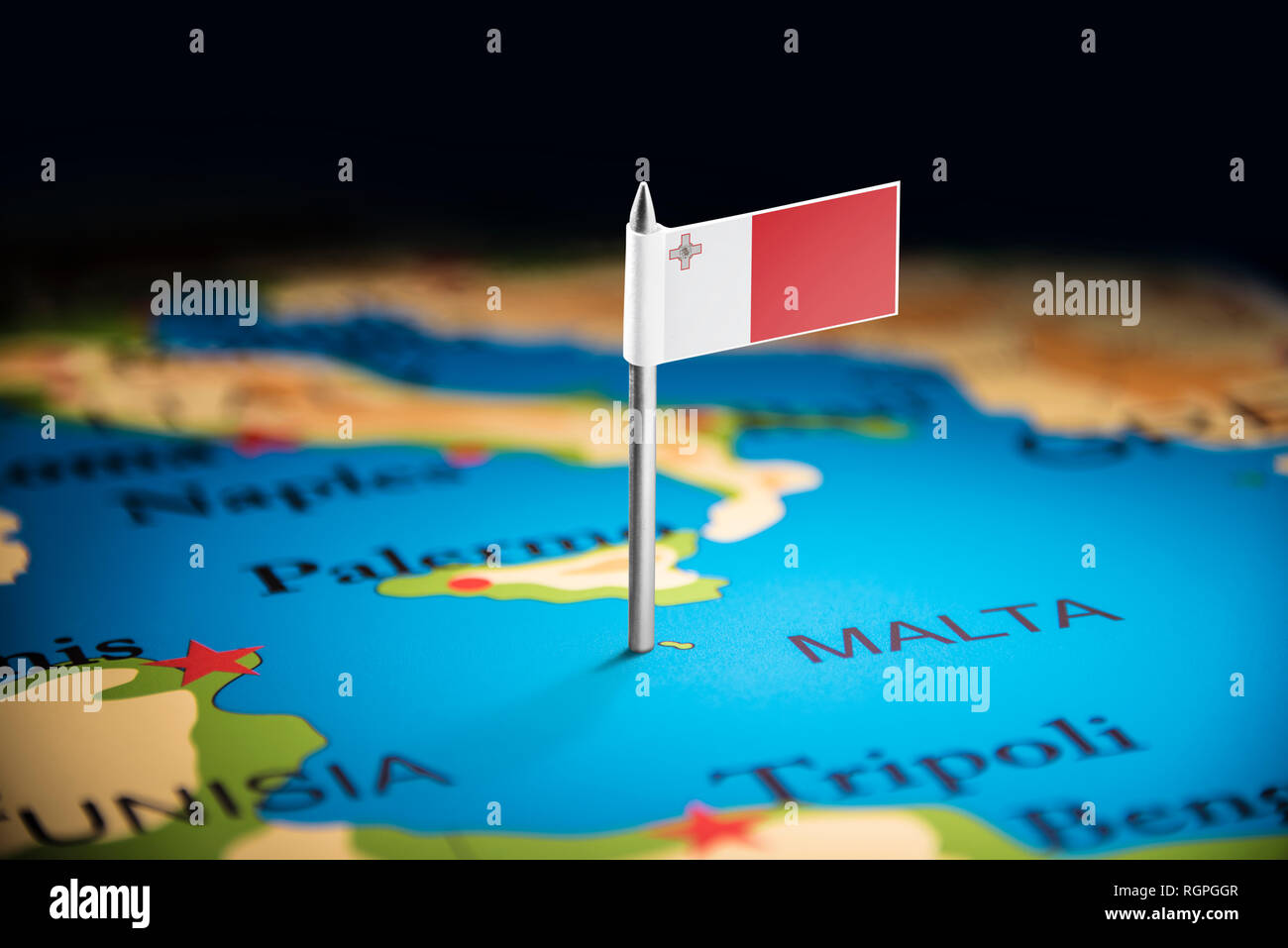 Malta marked with a flag on the map Stock Photo - Alamy