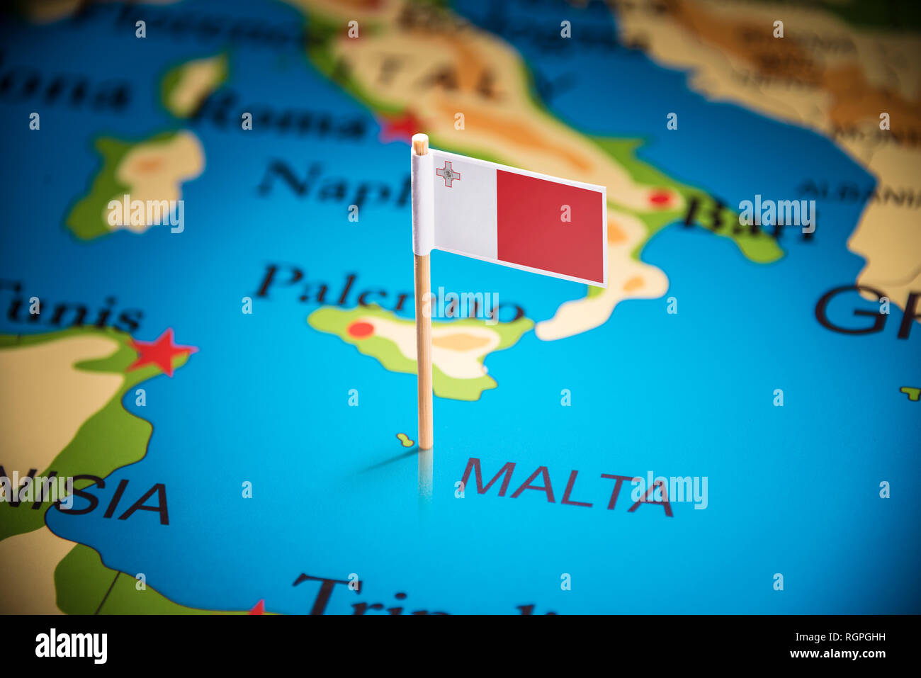 Malta marked with a flag on the map Stock Photo - Alamy
