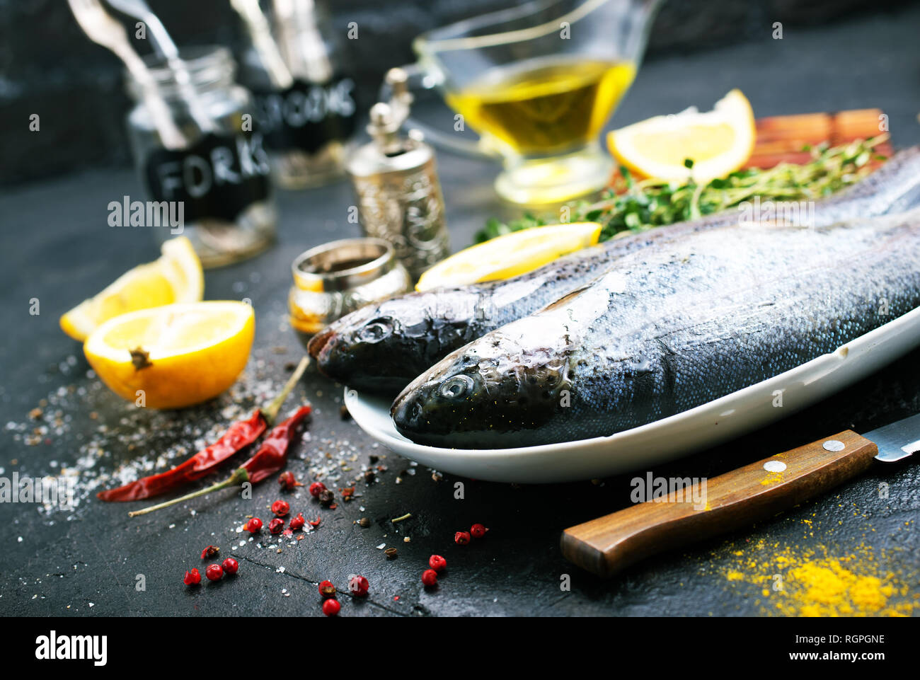 raw fish with salt and aroma pepper spice Stock Photo - Alamy