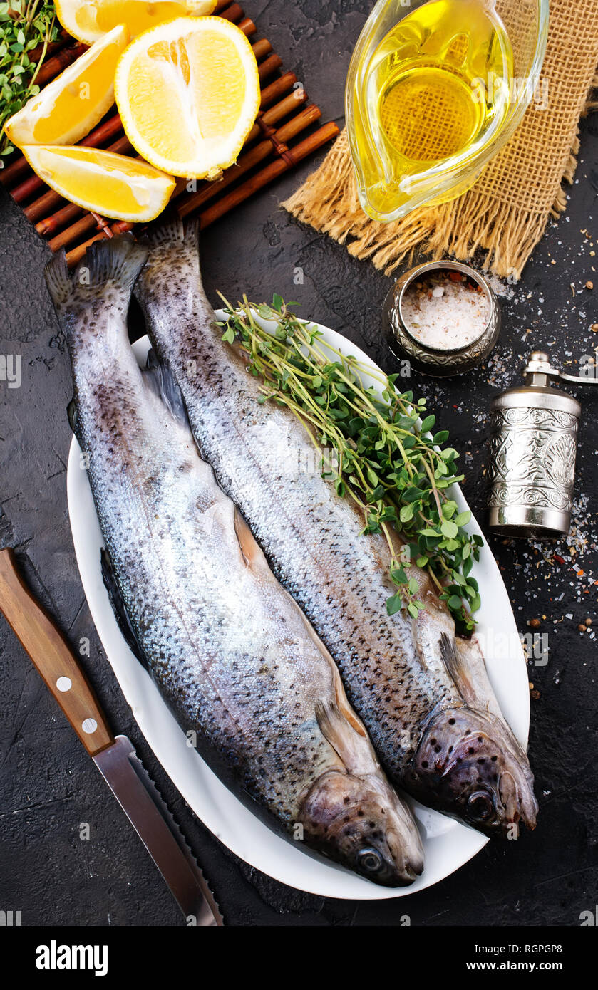 raw fish with salt and aroma pepper spice Stock Photo - Alamy