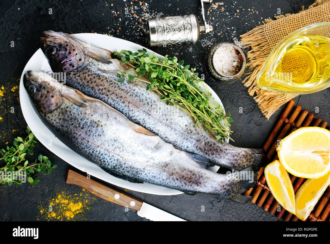 raw fish with salt and aroma pepper spice Stock Photo - Alamy