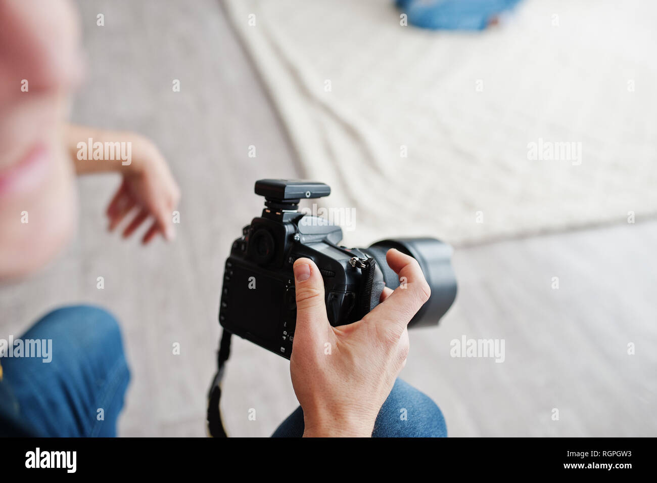 Photographer shooting hands close up and model posing on background at ...