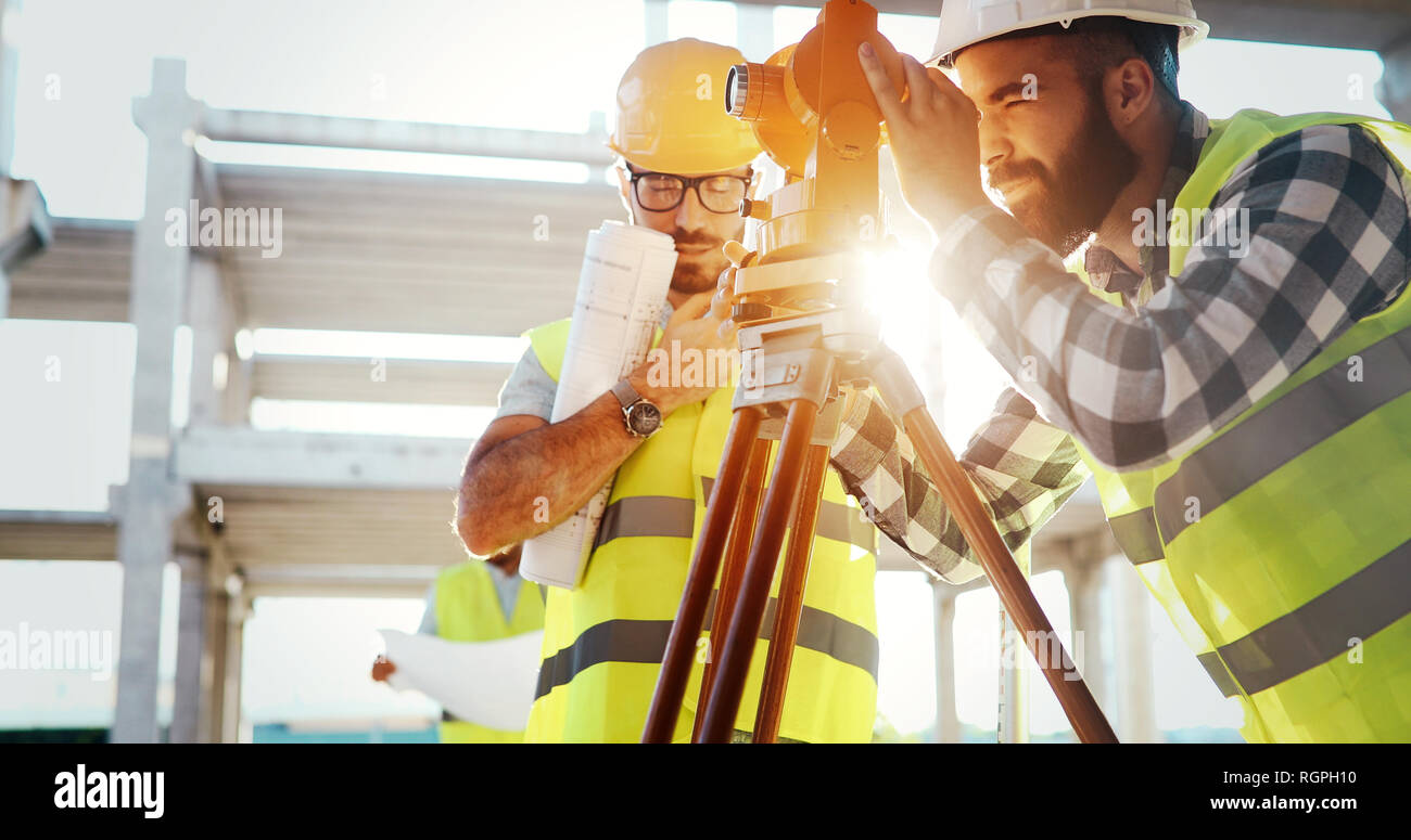 Portrait of construction engineers working on building site Stock Photo ...