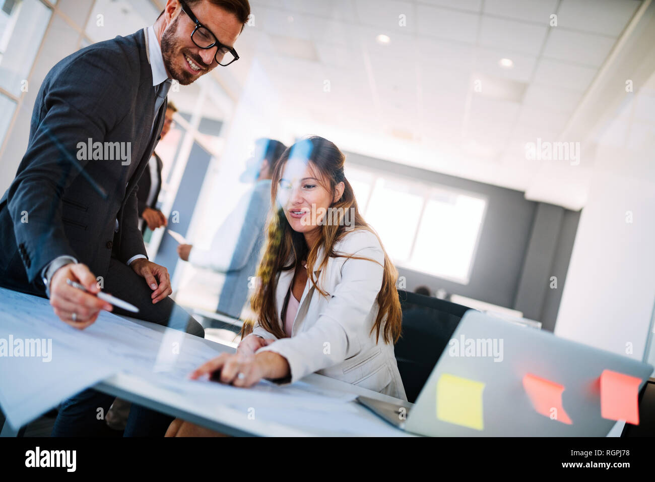 Office discussion cheerful hi-res stock photography and images - Alamy